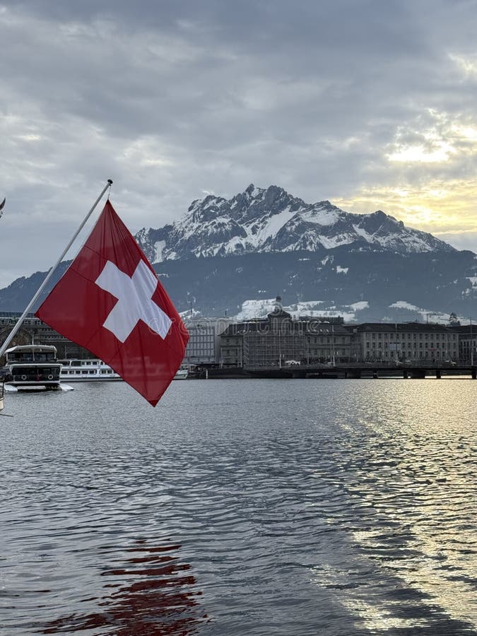 Swiss Flag on Lake Lucerne with Snowy Mountain View Stock Photo - Image ...