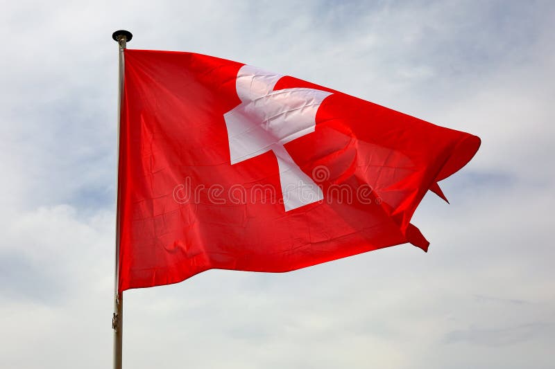 The Swiss Flag Waving in a Cloudy Sky Stock Photo - Image of politic ...