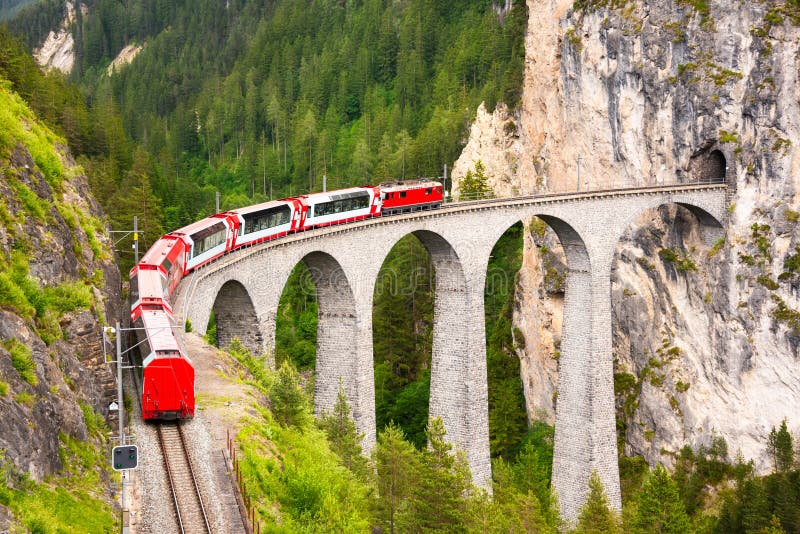 Swiss Red Train on Viaduct in Mountain, Scenic Ride Stock Photo - Image ...