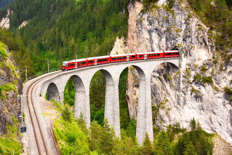 Swiss Red Train on Viaduct in Mountain, Scenic Ride Stock Photo - Image ...