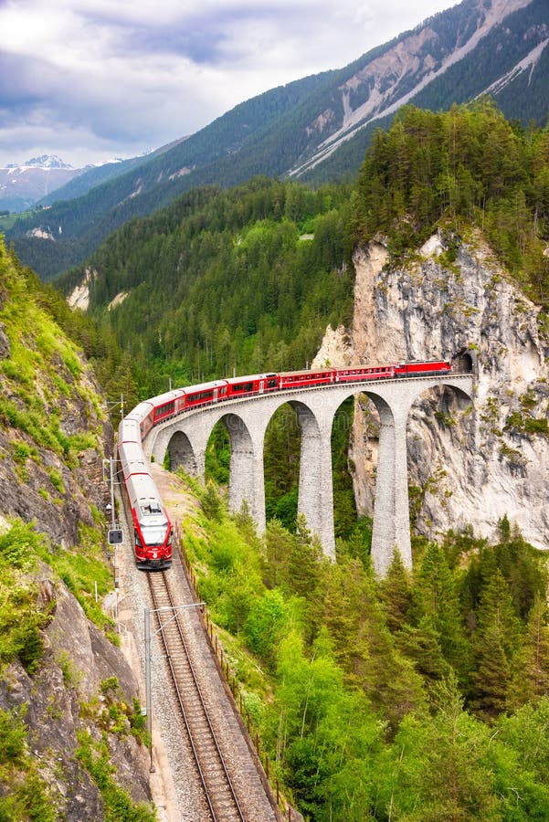 Swiss Red Train on Viaduct in Mountain, Scenic Ride Stock Photo - Image ...