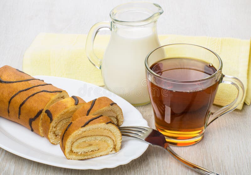 Swiss Roll Cake in Dish, Jug Milk and Tea Stock Image - Image of meal ...