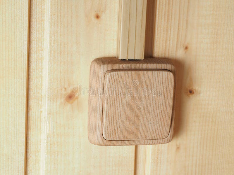 The Switch in the Color of Wood is Installed on a Wooden Wall in the ...
