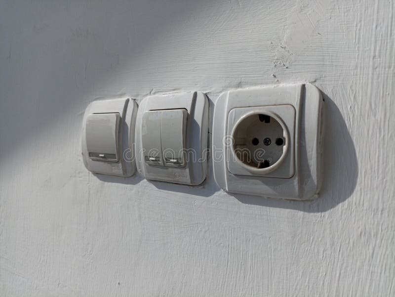 Switch and Electrical Socket on the Outside Wall of the House with a ...