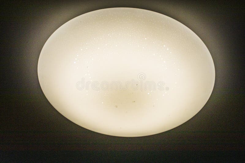 Switched on Ceiling Light of a Regular Stock Photo - Image of simple ...