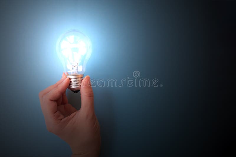Row of Switched Off Light Bulbs with One Switched on. Stock Image ...