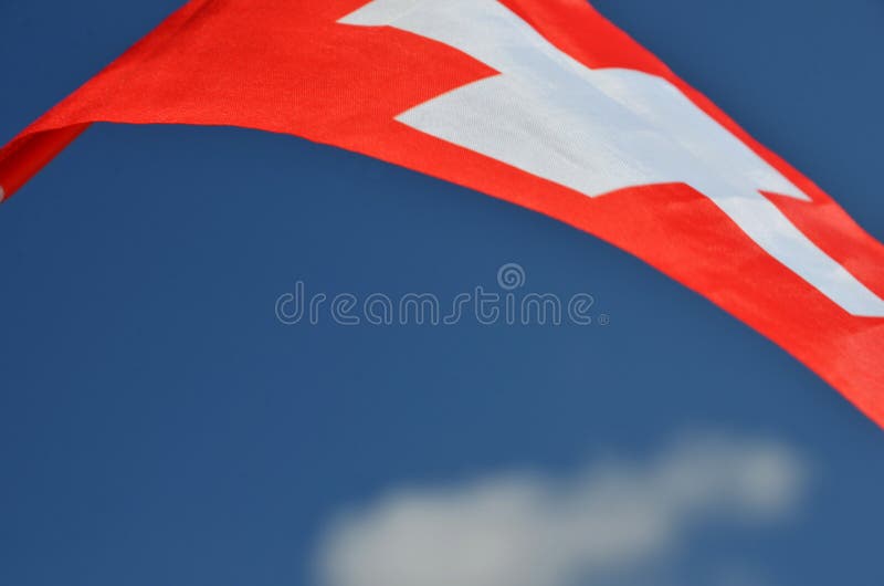 Switzerland Flag with Fabric Structure Against Blue Sky Stock Photo ...