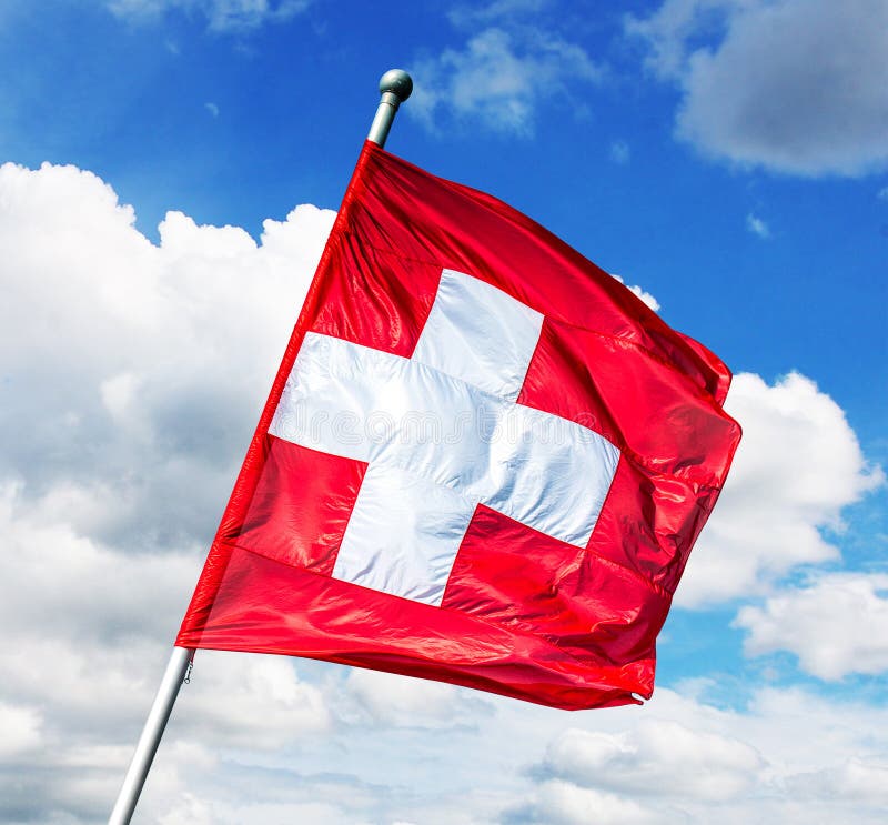 Waving Swiss Flag In Front Of Blue Sky Stock Photo - Image of front ...