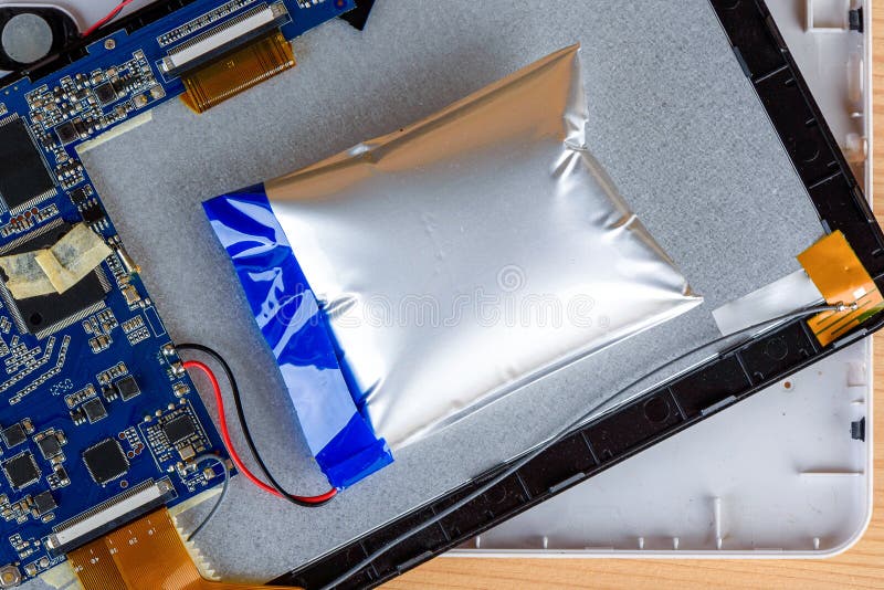 A Swollen Battery in a Disassembled Electronic Device. Stock Photo ...