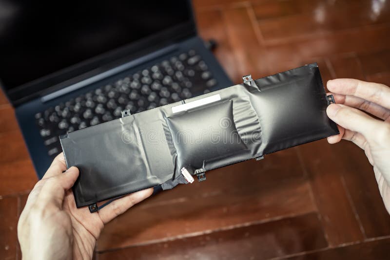 Swollen Laptop Battery in Hands Stock Photo - Image of energy ...