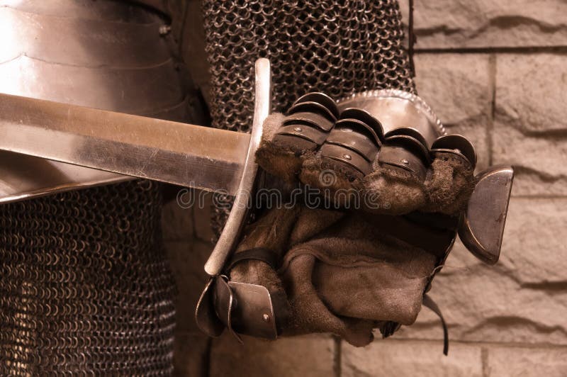 Sword in a hand of knight stock photo. Image of guard - 21855252