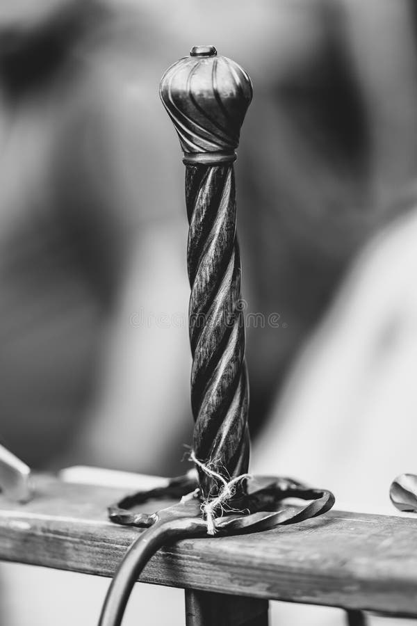 A Sword with a Twisted Handle is Shown in Black and White Stock Photo ...
