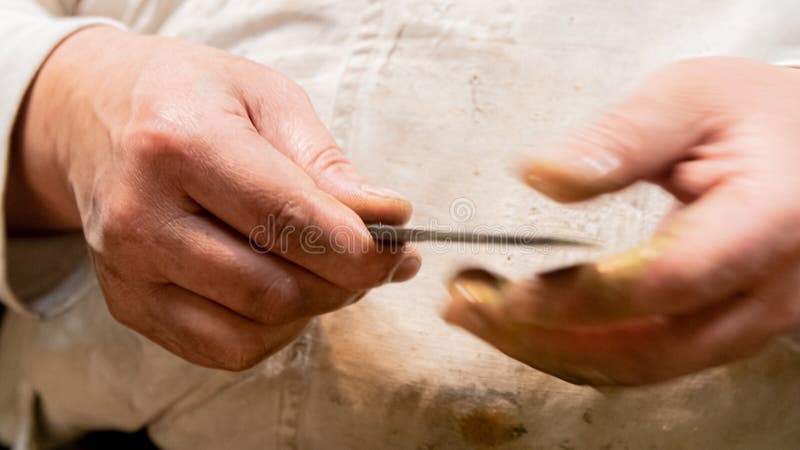 Sharpening a Katana sword stock image. Image of whet - 26568821
