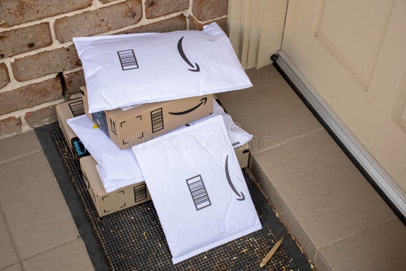 Amazon Prime Boxes and Envelopes Delivered To a Front Door of ...