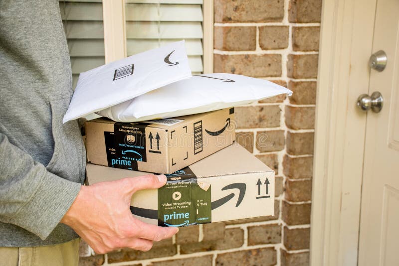 Amazon Prime Boxes and Envelopes Delivered To a Front Door of ...