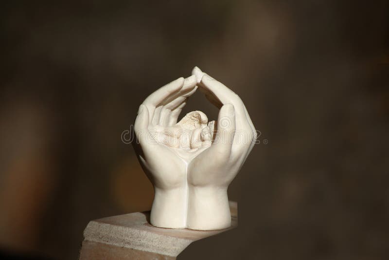 A Symbol of Caring for Another Stock Photo - Image of dark, wings ...