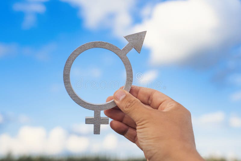 The Symbol of Gender Equality is Silver in the Hand Against the Sky ...