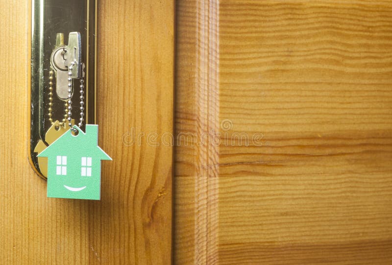 A Key in a Lock with House Icon on it Stock Photo - Image of loan ...