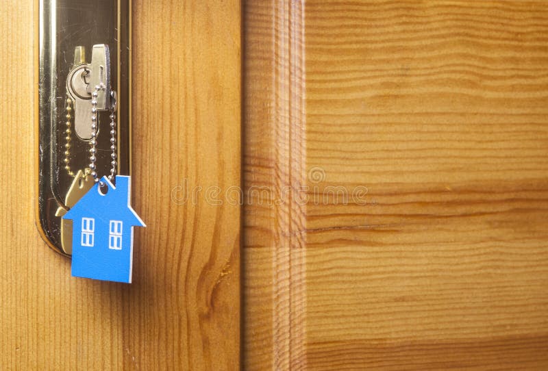 A Key in a Lock with House Icon on it Stock Image - Image of ...