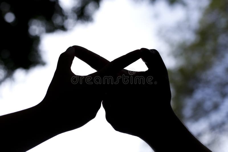 Symbol of Infinity with Hands Stock Image - Image of hands, backlight ...
