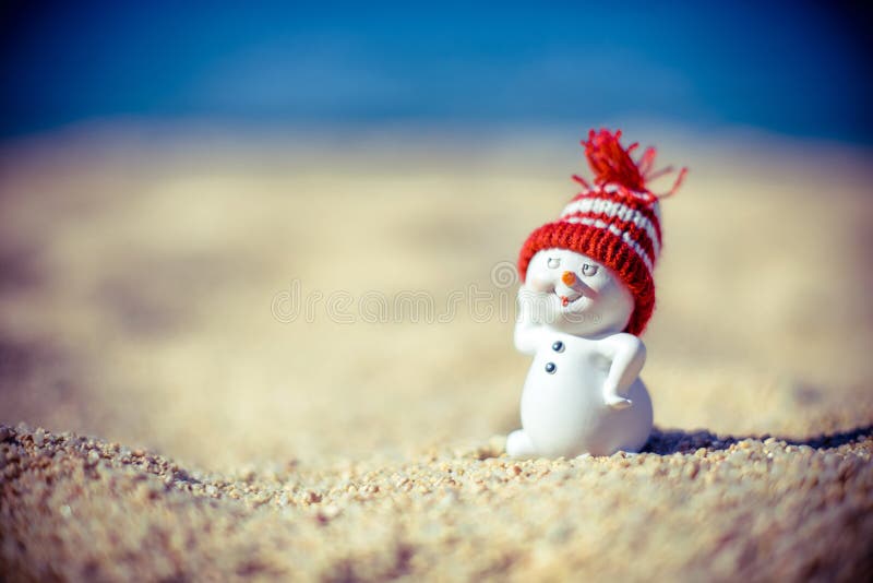 A snowman on the beach stock photo. Image of snowman - 103584042