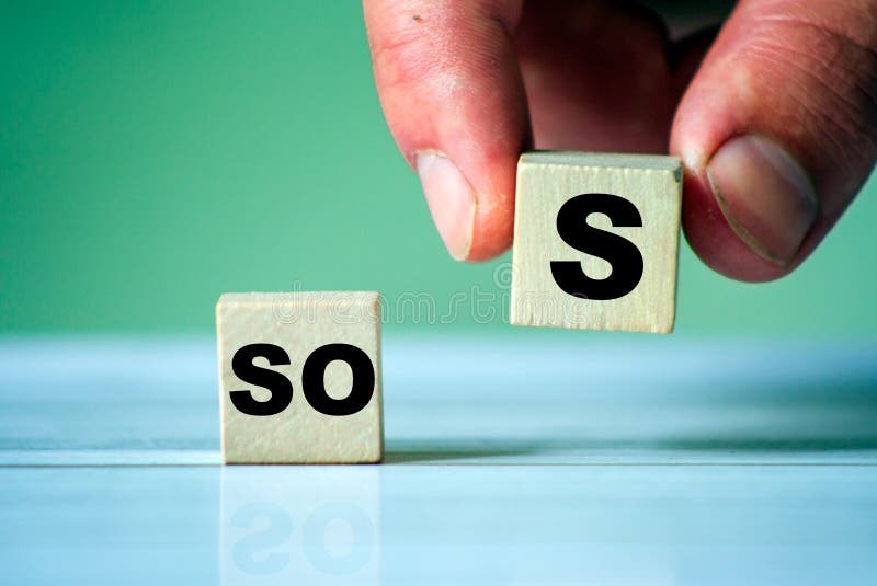Symbol of SOS with Word on Wooden Cube Blocks. Hand Hold One Cube Stock ... Symbol of SOS with Word on Wooden Cube Blocks. Hand Hold One Cube Stock ...