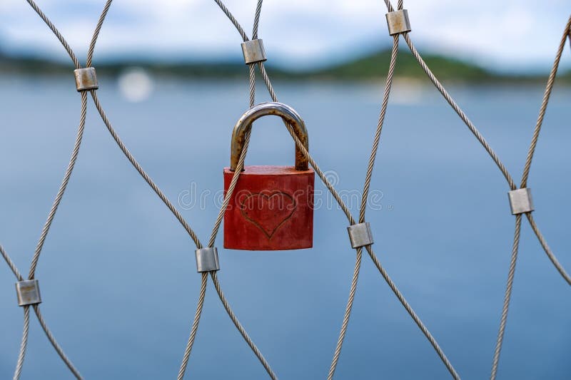 Symbolic Red Padlock Featuring Heart Design Secured To Bridge Cables ...