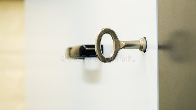 Symbolizing Access and Security, a Modern Silver Key is Inserted into a ...