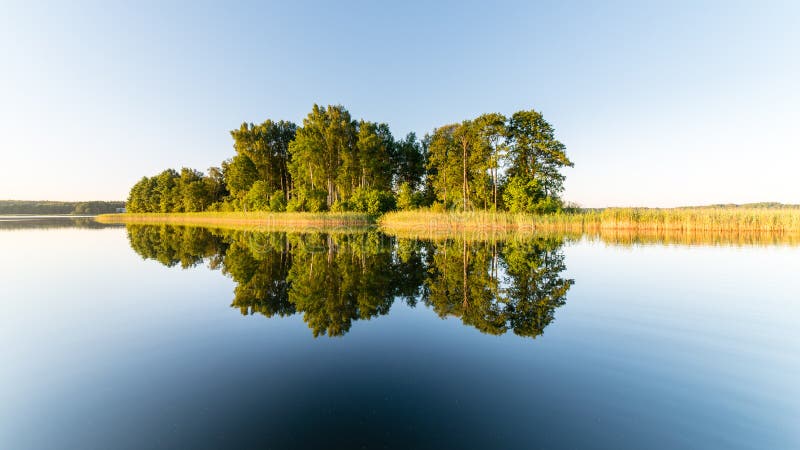Symmetric Reflections on Calm Lake Stock Image - Image of forest ...