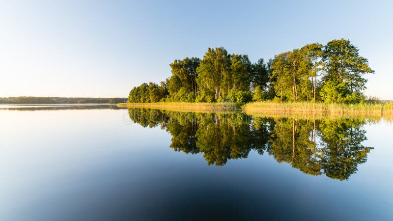 Symmetric Reflections on Calm Lake Stock Photo - Image of fototurisms ...