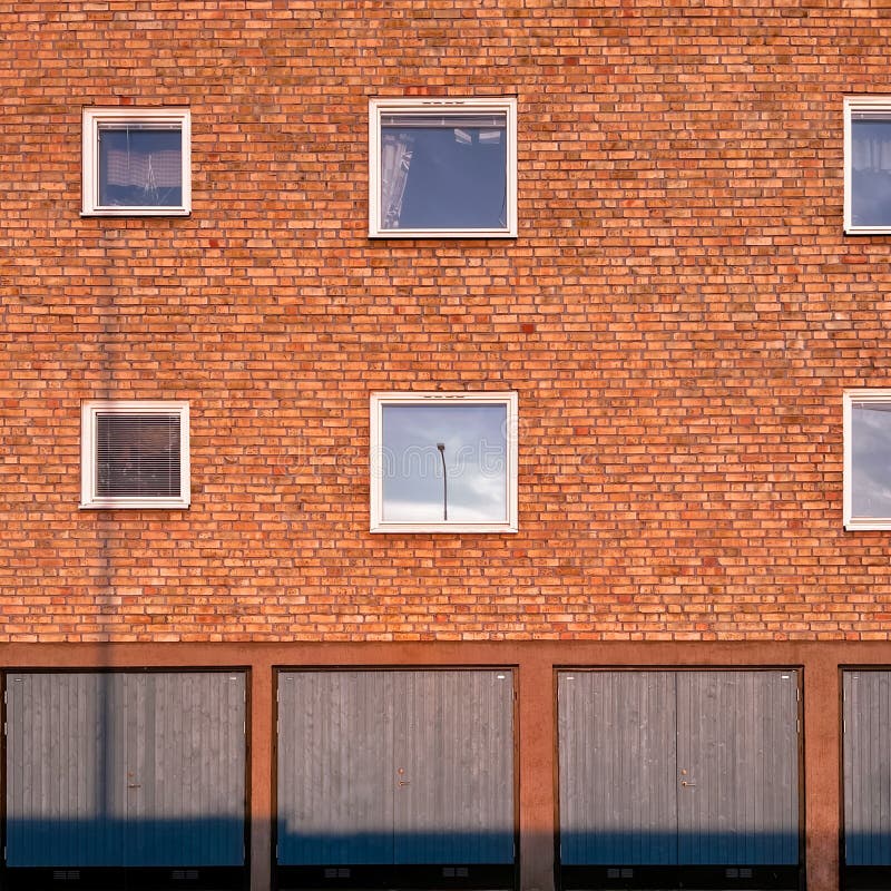 Symmetrical Brick Building with Multiple Windows Stock Image - Image of ...