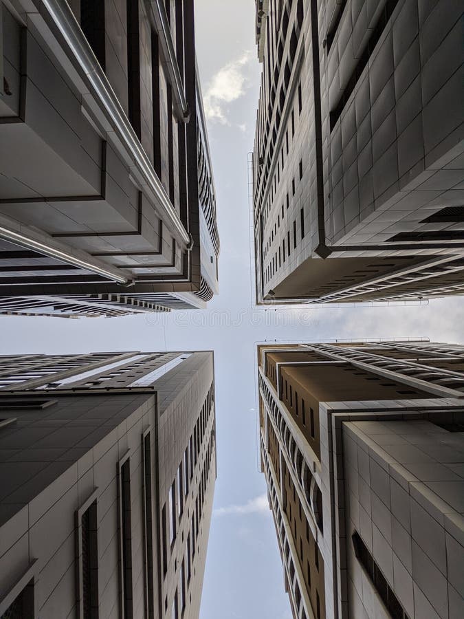 Symmetrical Cross in between Buildings Stock Image - Image of giving ...