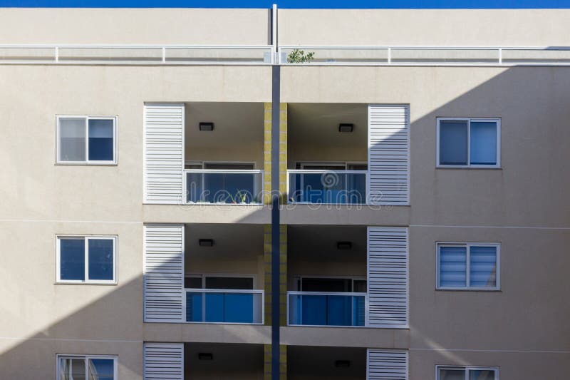 Modern Apartment Building Facade with Balconies and Symmetrical Design ...