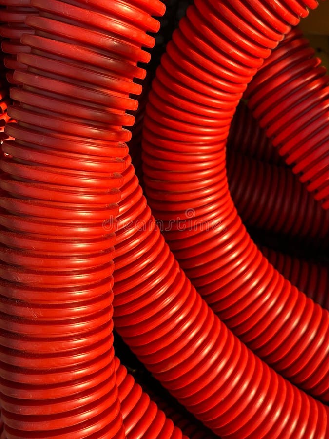 Symmetrical Formation of Red Hoses in a Cylindrical Pattern. Stock ...