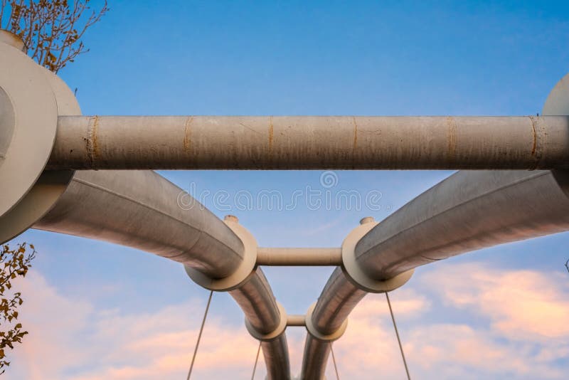 Symmetrical Steel Pipes Supporting a Suspension Bridge Over a River ...