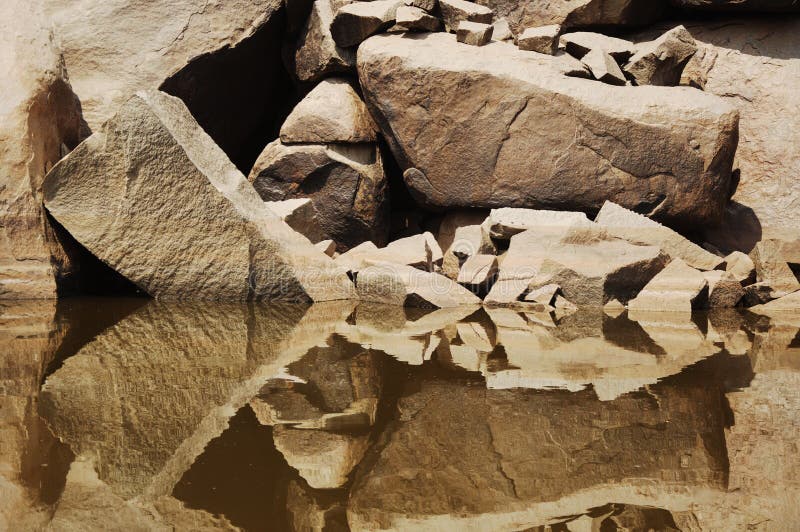 Symmetry of stones stock image. Image of rocks, reflection - 25306737