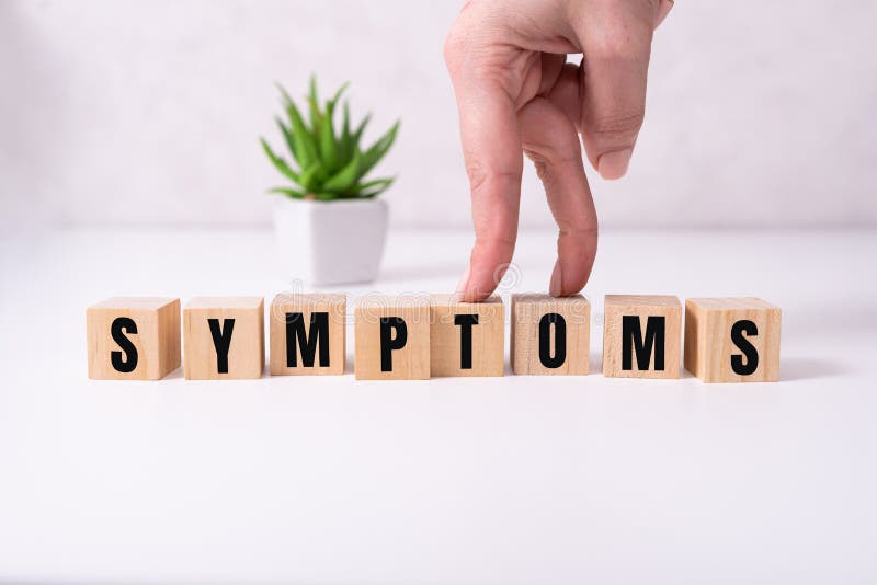 SYMPTOMS Text Word on Wooden Cubes on White Background. Stock Photo ...