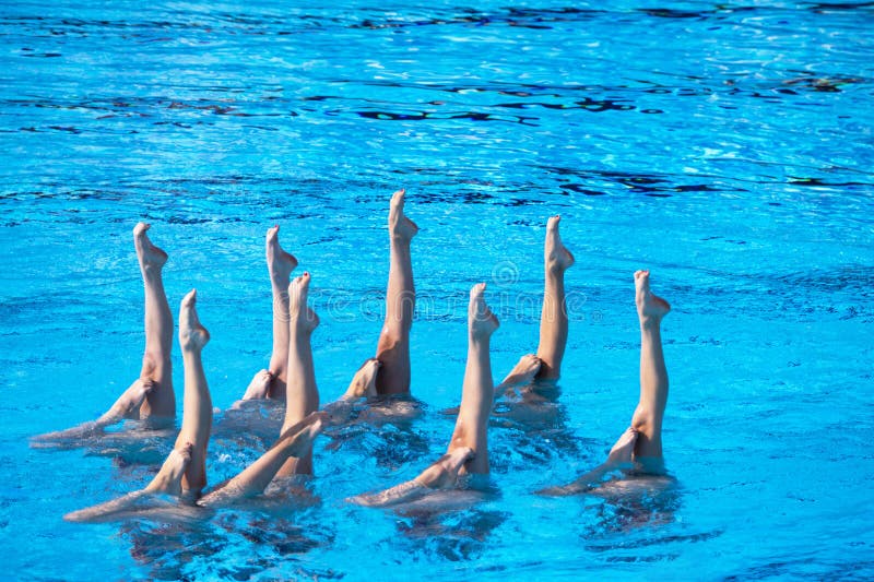 Synchronized or Artistic Swimmers Performing an Elegant and Precise ...