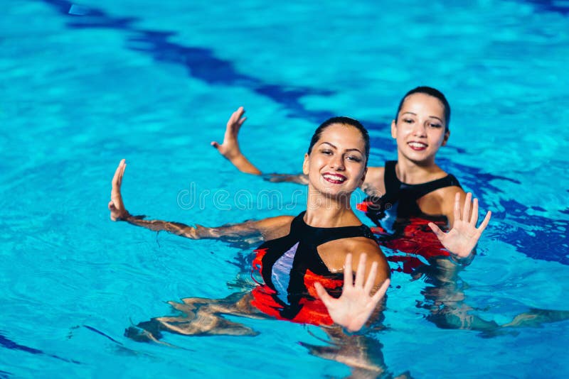 Synchronized Swimmers stock image. Image of people, color - 222166435