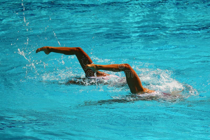 Synchronized Swimming Duet during Competition Stock Photo - Image of ...