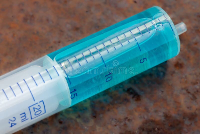 Syringe blue and ready stock photo. Image of medical - 179604416