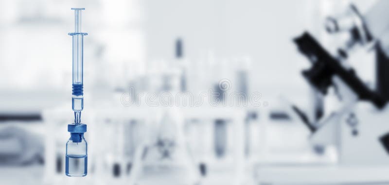 Syringe with Bottle of Drug in Blue on Blurred Back and White ...