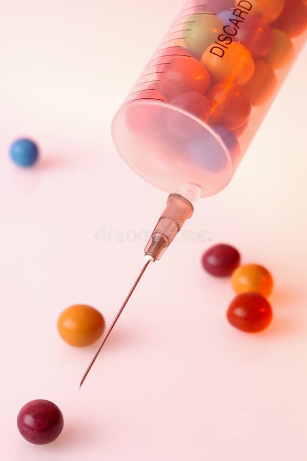 Syringe with Needle and Liquid Drugs in the Barrel in a Studio with ...