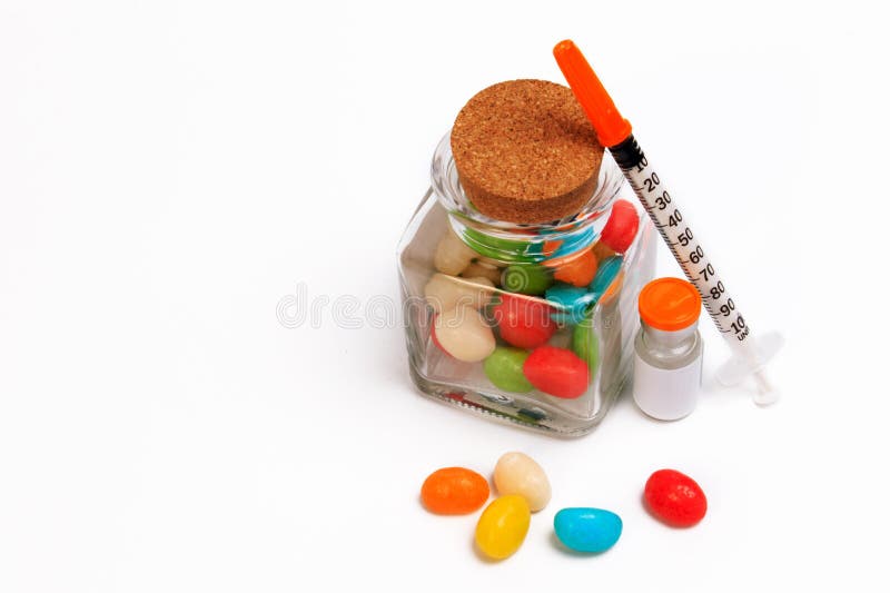 A Syringe and Candy Bottle Isolate on White Background. Stock Image ...