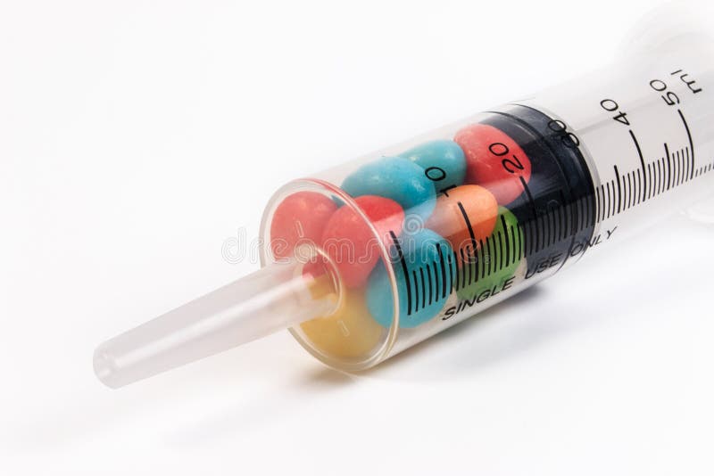 A Syringe and Candy Bottle Isolate on White Background. Stock Image ...