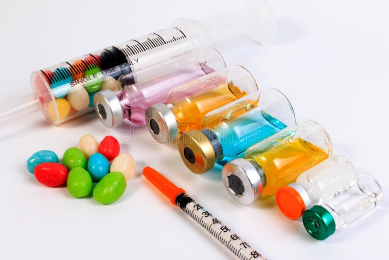 A Syringe and Candy Bottle Isolate on White Background. Stock Photo ...