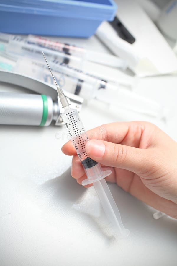 Syringe with a Clear Solution at Hand. a Nurse at the Hospital Stock ...