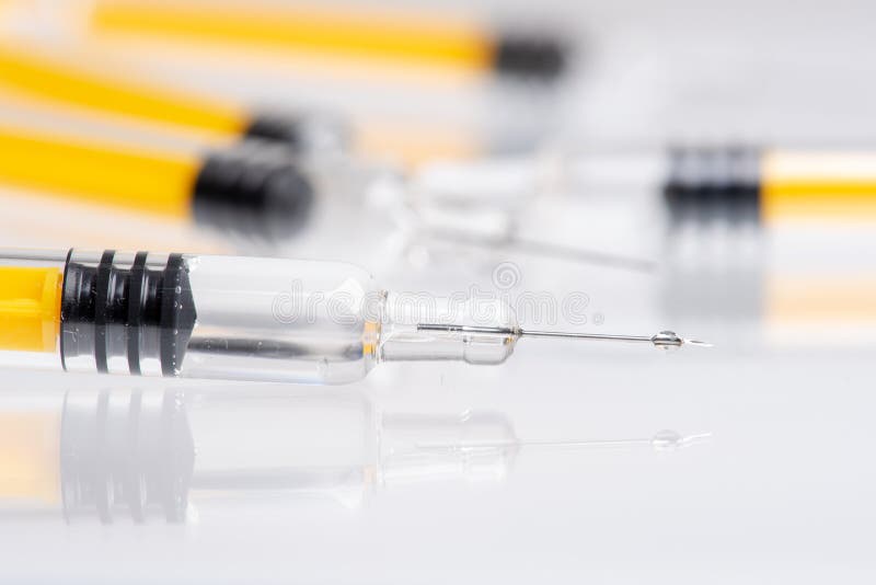 Syringe with Focus on Needle with Drop Stock Photo - Image of hospital ...