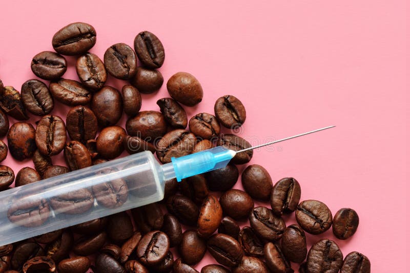 Syringe with Coffee Beens on Pink Background - Concept of Coffee and ...