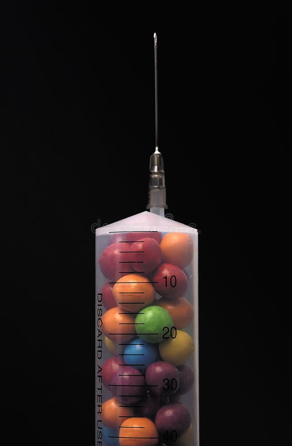 Syringe with Needle and Liquid Drugs in the Barrel in a Studio with ...